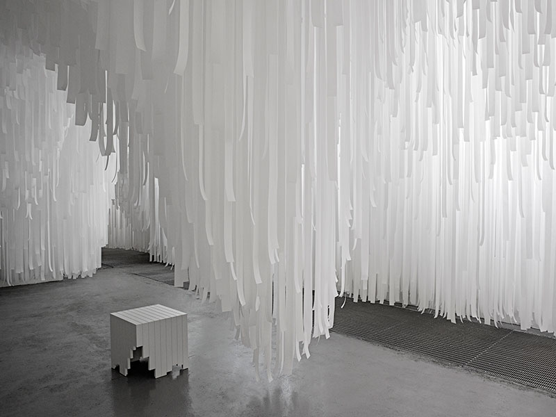 Snarkitecture creates a ’’cave’’ with paper-tissued suspended waves