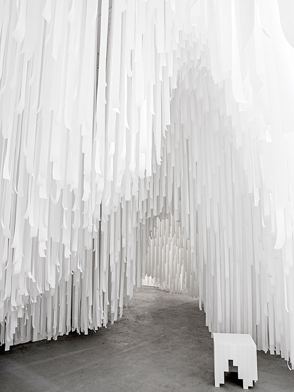 Snarkitecture creates a ’’cave’’ with paper-tissued suspended waves