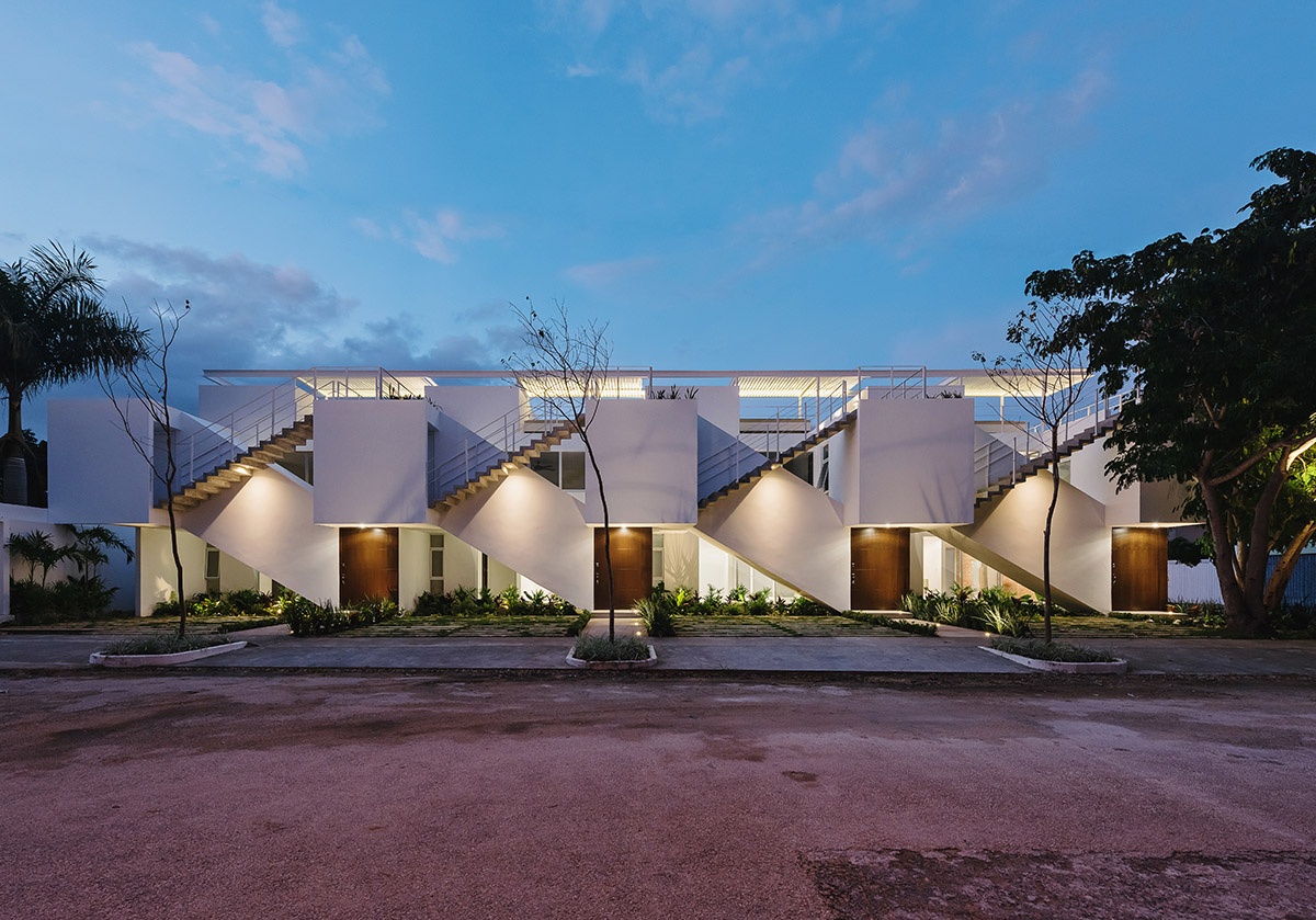 Intersection of staircases forms the facade of this multi-family ...