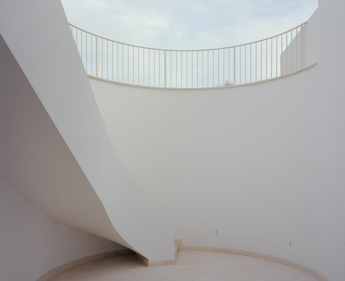 Rural retreat filters light through its stone porous screen in the ...