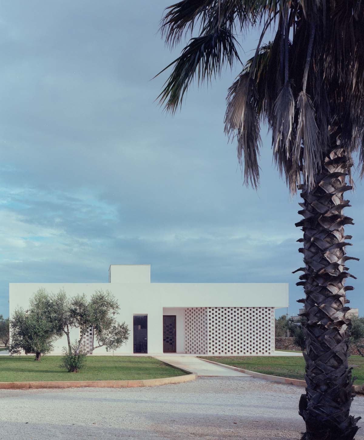 Rural retreat filters light through its stone porous screen in the ...