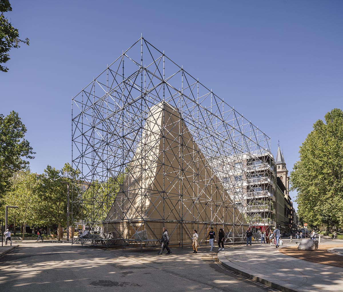 Aire Pavilion wrapped by giant scaffolding represents "unfinished ...