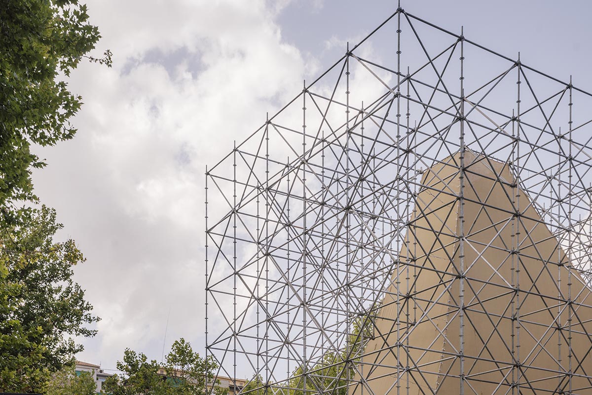 Aire Pavilion wrapped by giant scaffolding represents "unfinished ...