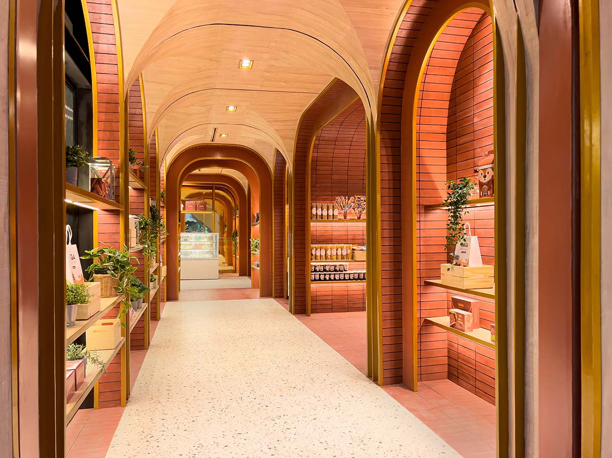 Bakery interior mimics arches and portals with bright red bricks in ...