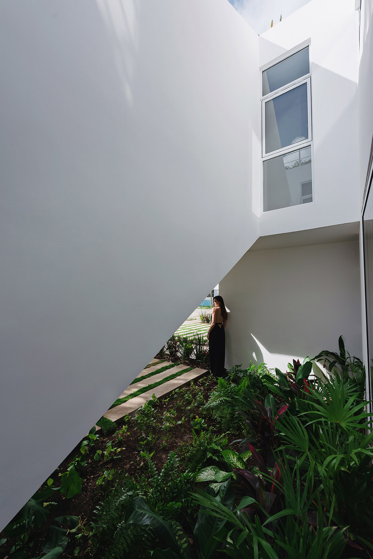 Intersection of staircases forms the facade of this multi-family ...