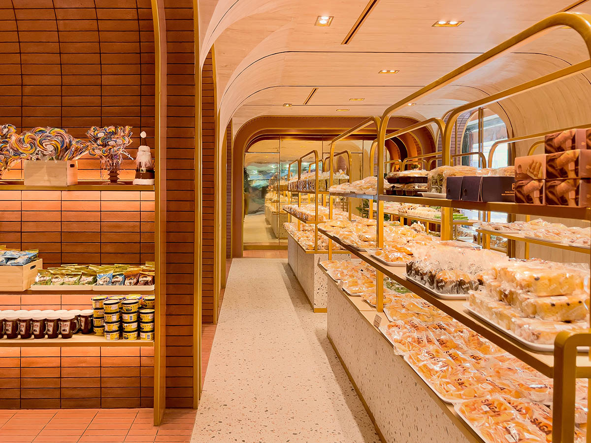 Bakery interior mimics arches and portals with bright red bricks in Papua, Indonesia