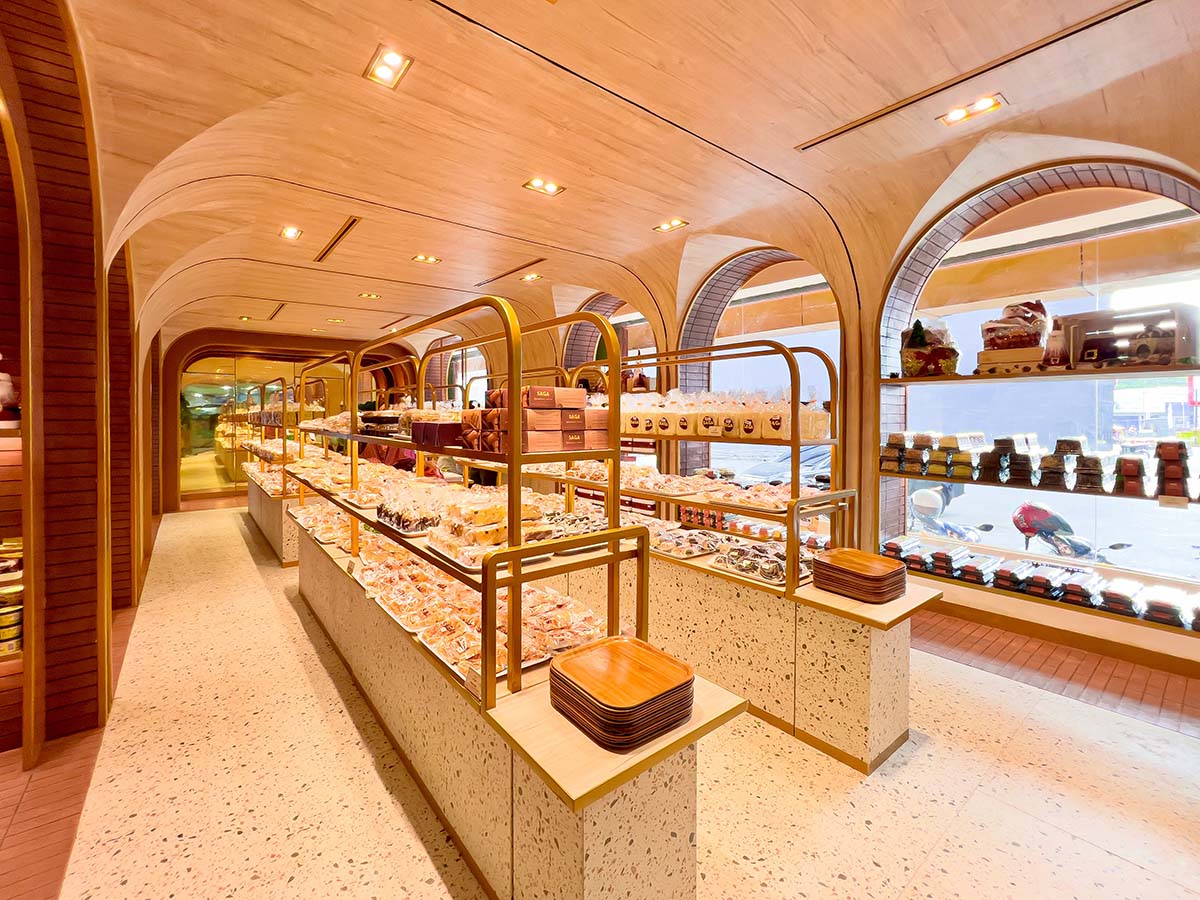 Bakery interior mimics arches and portals with bright red bricks in ...