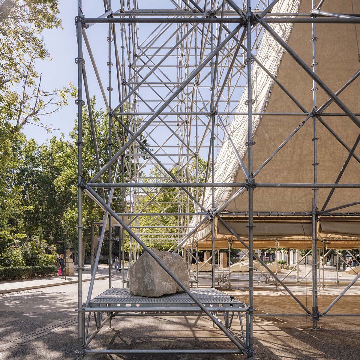 Aire Pavilion wrapped by giant scaffolding represents "unfinished ...