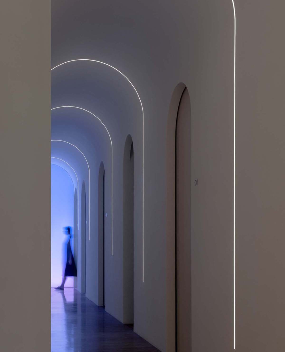 Smooth corners and rounded walls form cave-like wellness center ...