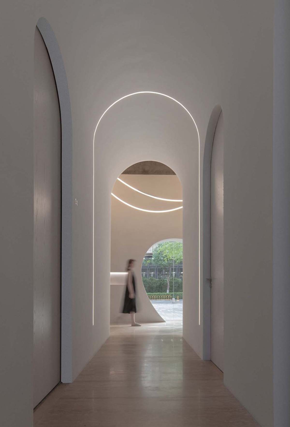 Smooth corners and rounded walls form cave-like wellness center ...