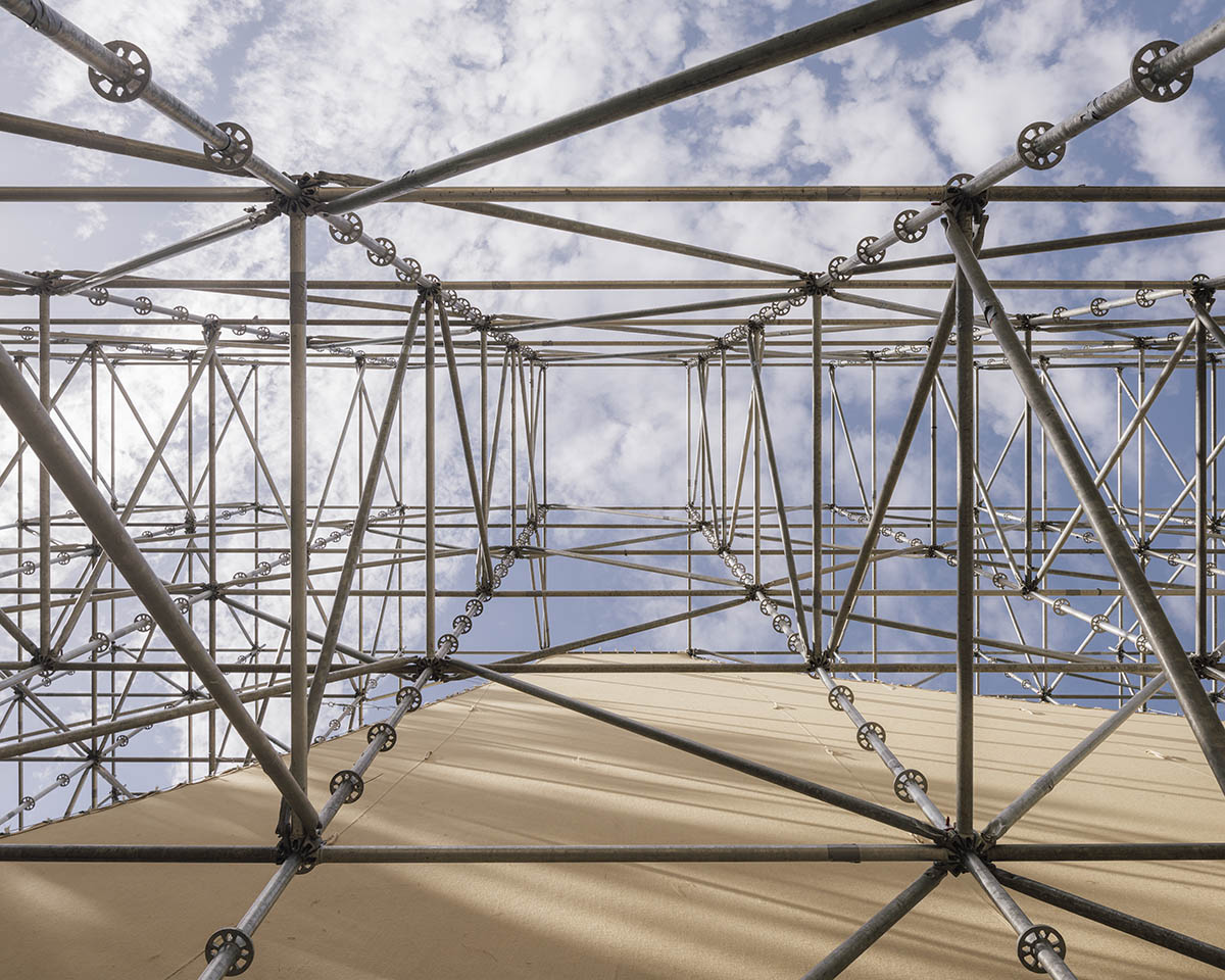 Aire Pavilion wrapped by giant scaffolding represents "unfinished ...