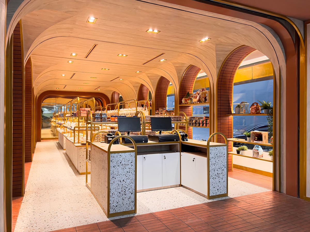 Bakery interior mimics arches and portals with bright red bricks in ...