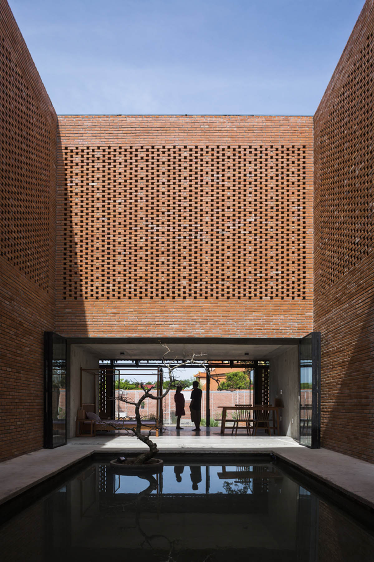 This Innovative Brick House In Vietnam Creates Continuous Internal Spaces