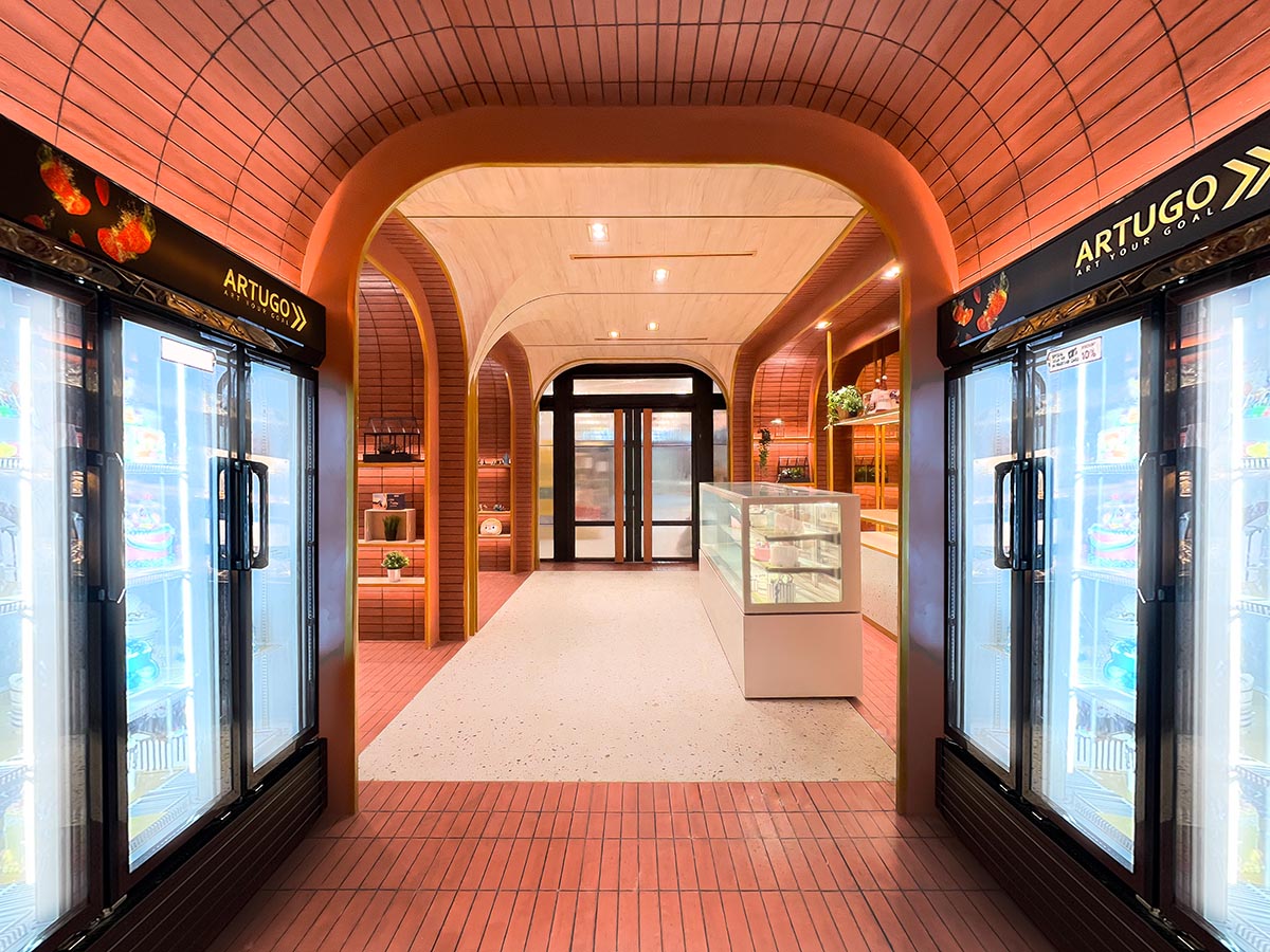 Bakery interior mimics arches and portals with bright red bricks in ...