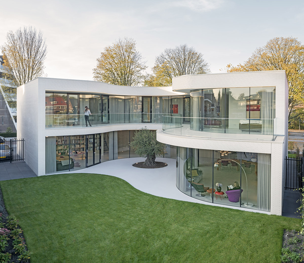 MVRDV completes Casa Kwantes house with fluid glass walls in Rotterdam