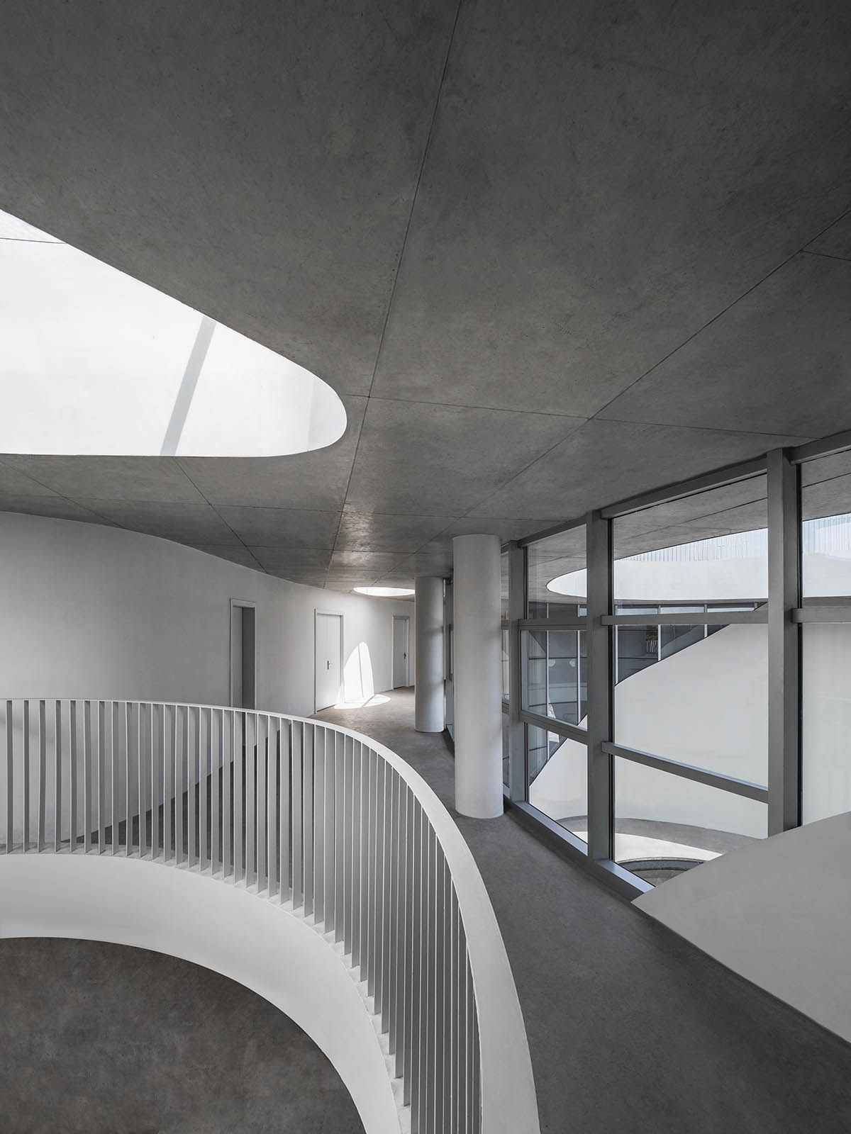 CROX reveals cultural center with drop-shaped windows with flowing ...