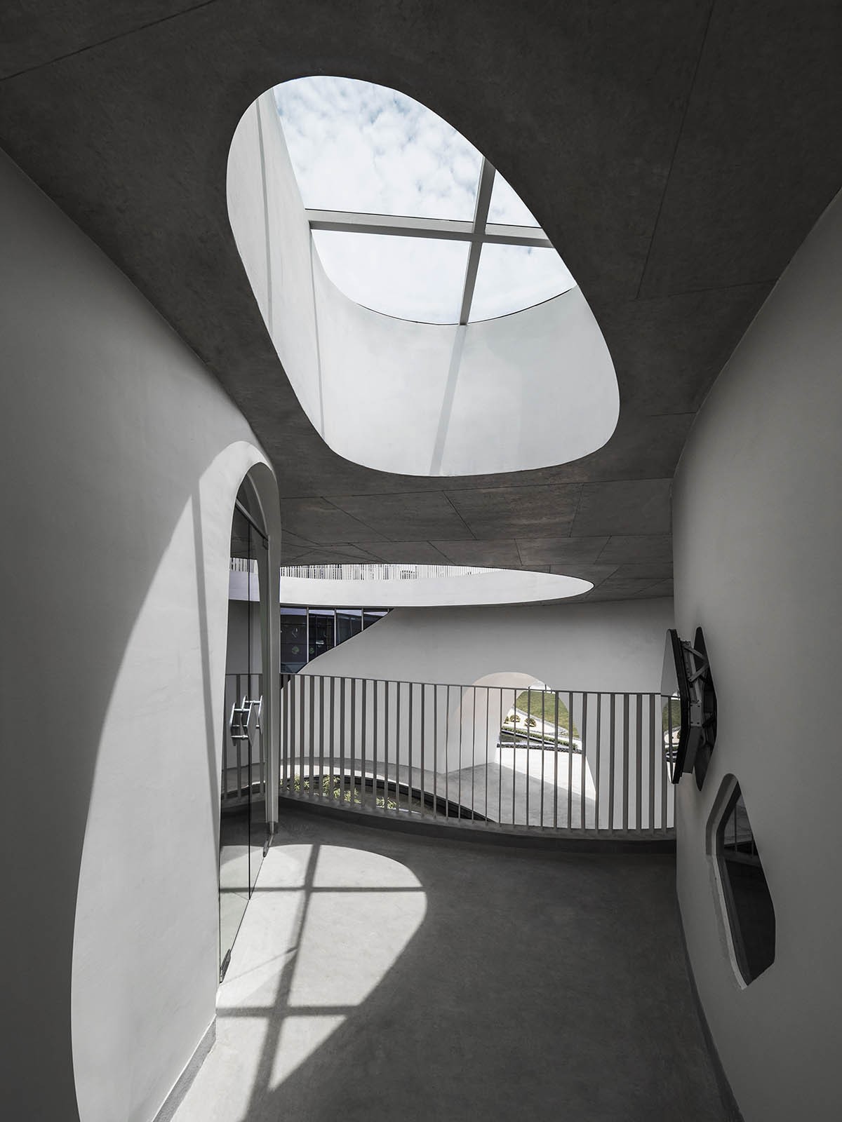 CROX reveals cultural center with drop-shaped windows with flowing ...