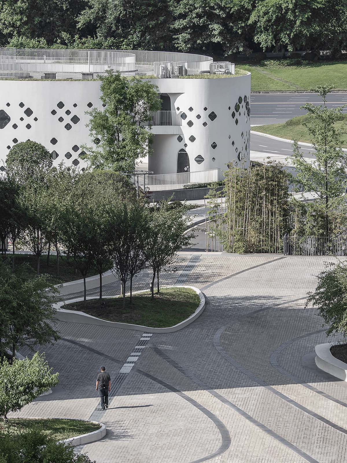 CROX reveals cultural center with drop-shaped windows with flowing ...