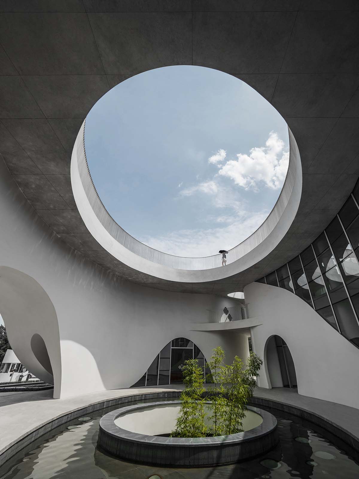 CROX reveals cultural center with drop-shaped windows with flowing ...