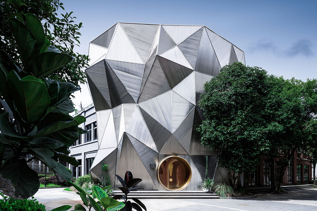 Angular corrugated stainless steel sheets form this showroom designed ...