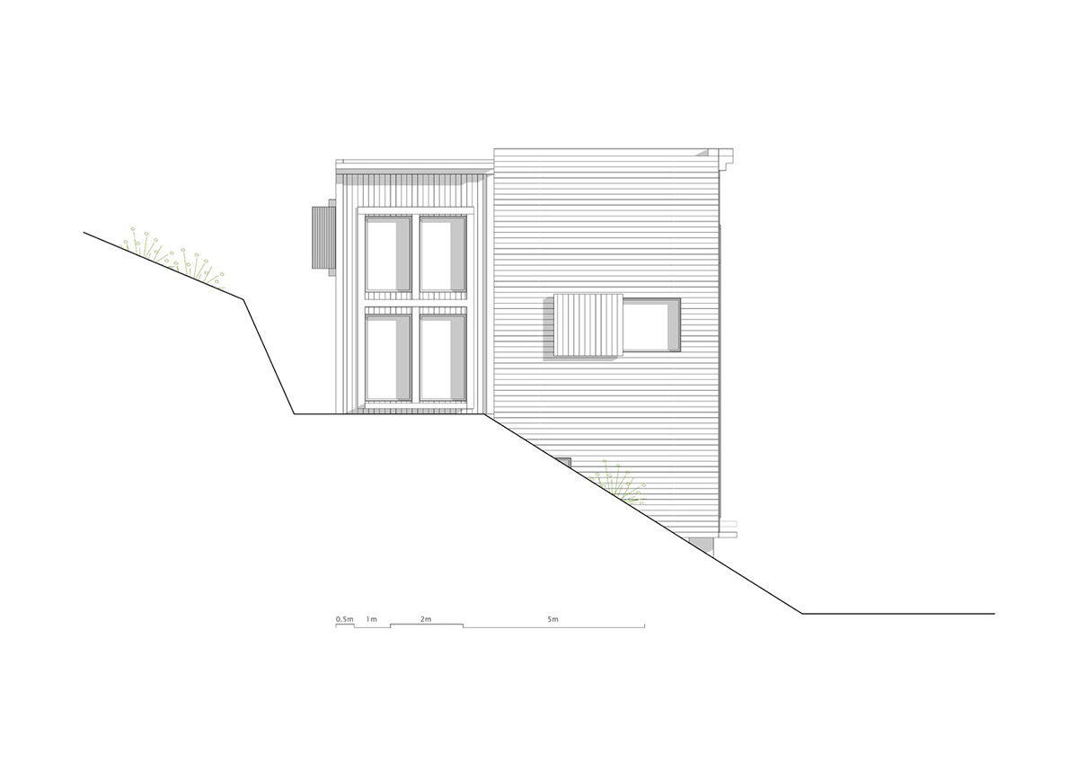 High windows allow users to get well-lit living spaces for this house ...