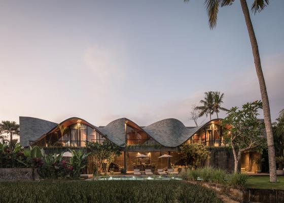 Twisted roof becomes walls and facade in Alpha House designed by Alexis ...