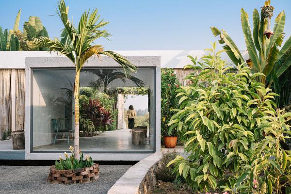 Weekend home is clad in bamboo screens that create a rustic appearance ...