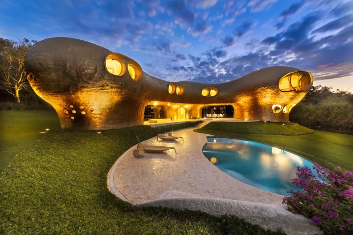 Javier Senosiain’s Amoeba House supported on three legs and painted ...